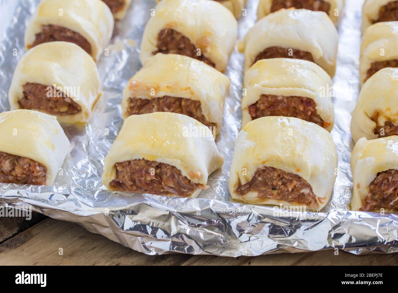 Uncooked sausage rolls hi-res stock photography and images - Alamy