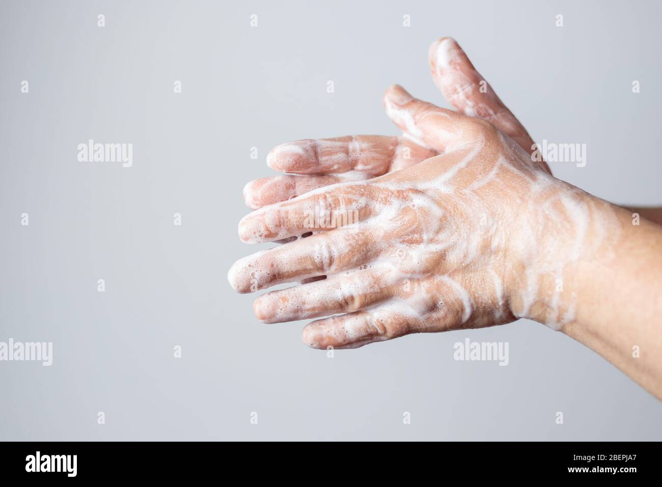 hand washing with soap to protect against the spread of the coronavirus ...