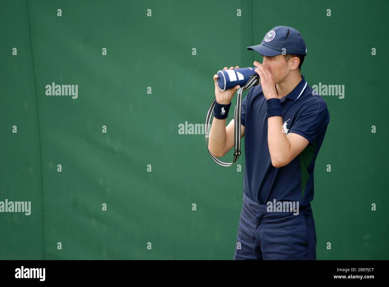 Ball Boy drinking at the Wimbledon Lawn Tennis 2019 Championship ...