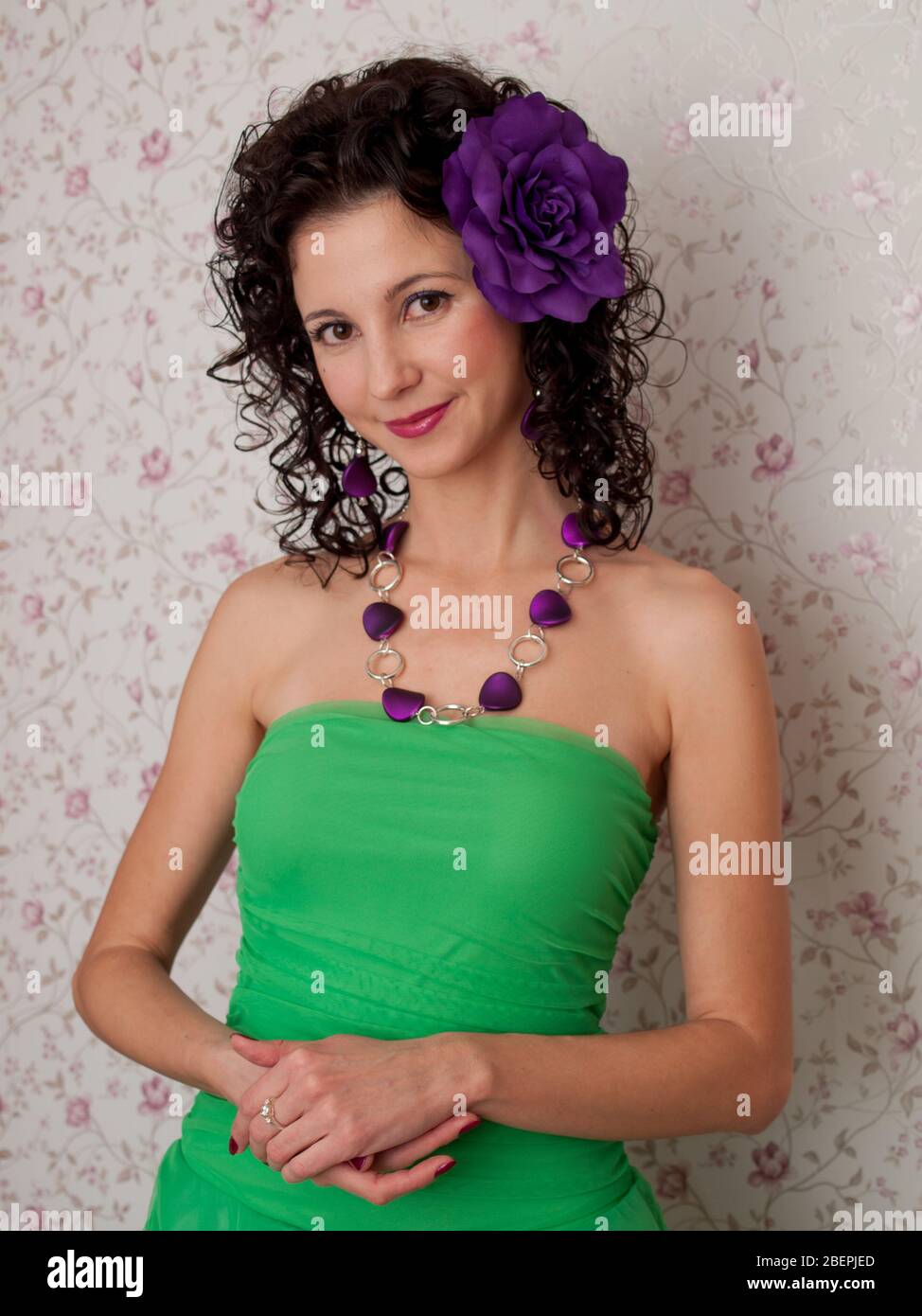 Pin-up girl in retro vintage old-fashioned dress, curly hair, Flower in ...