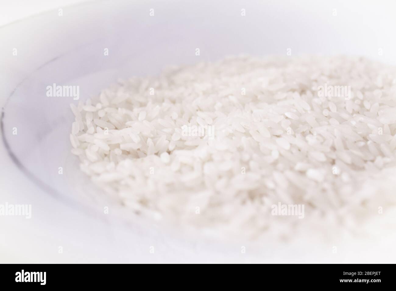 Uncooked white rice. Part of the rice out of focus. No people Stock ...