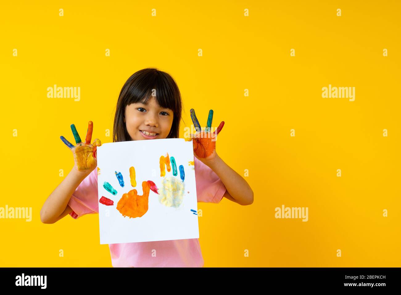 Portrait of young Asian girl with art, Thai kid show painting paper by ...