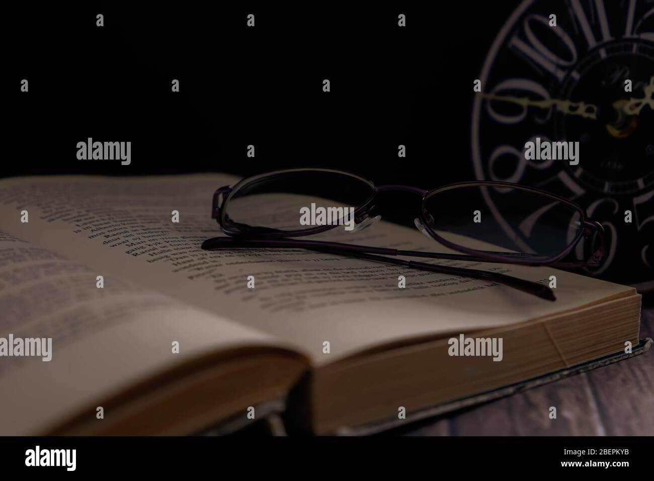 Reading an old book Stock Photo - Alamy