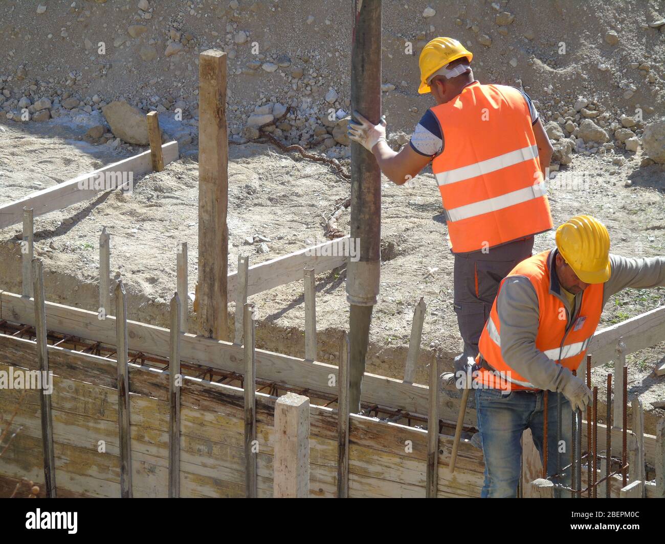 Construction Worker pouring Concrete Stock Photo - Alamy