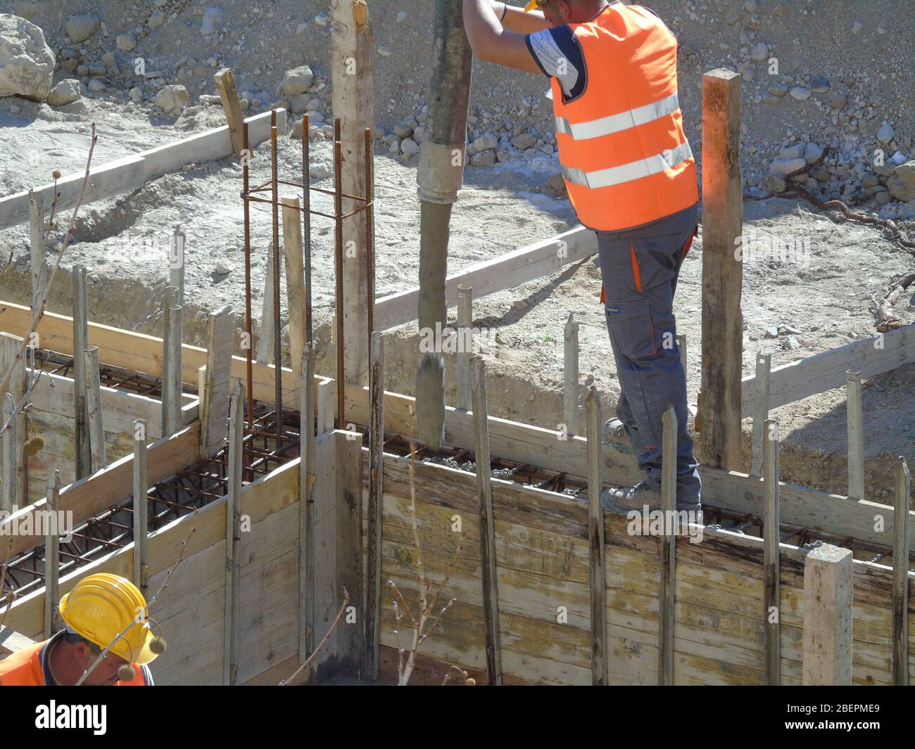 Construction Worker pouring Concrete Stock Photo - Alamy