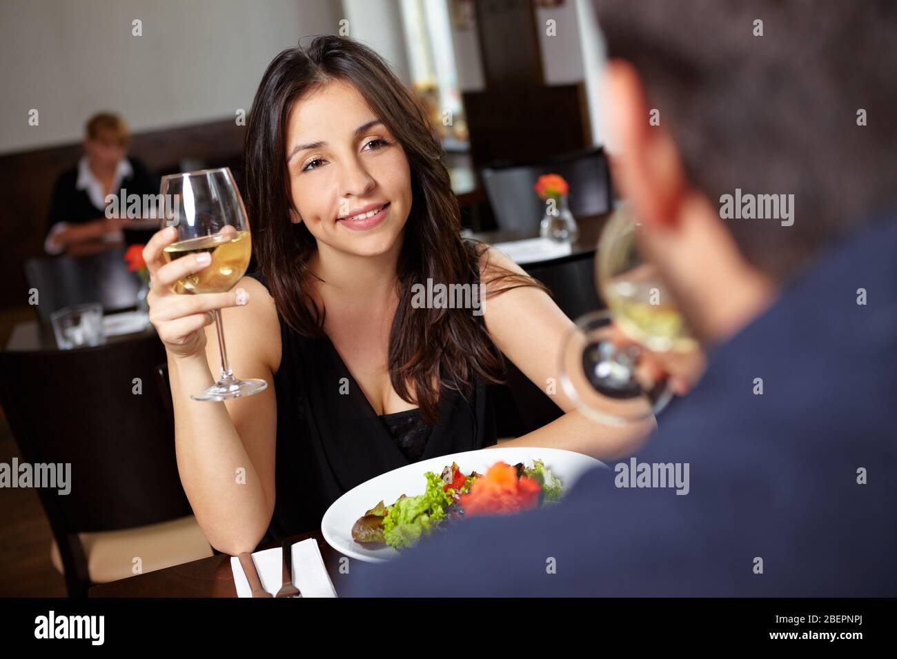 Couple having dinner together in the restaurant Stock Photo - Alamy