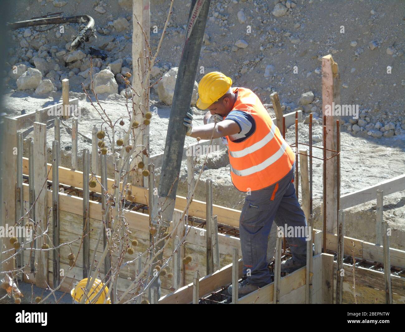 Construction Worker pouring Concrete Stock Photo - Alamy