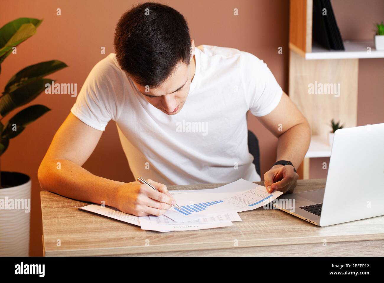 Tired employee working at desk at company office Stock Photo - Alamy