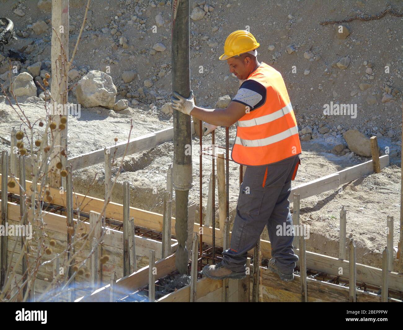 Construction Worker pouring Concrete Stock Photo - Alamy