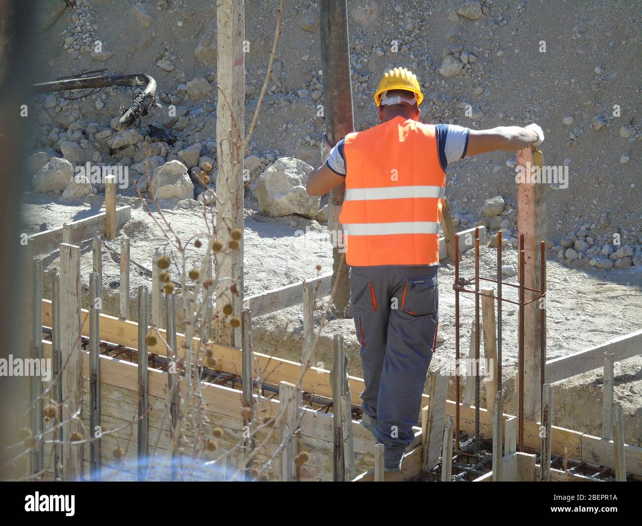 Construction Worker pouring Concrete Stock Photo - Alamy