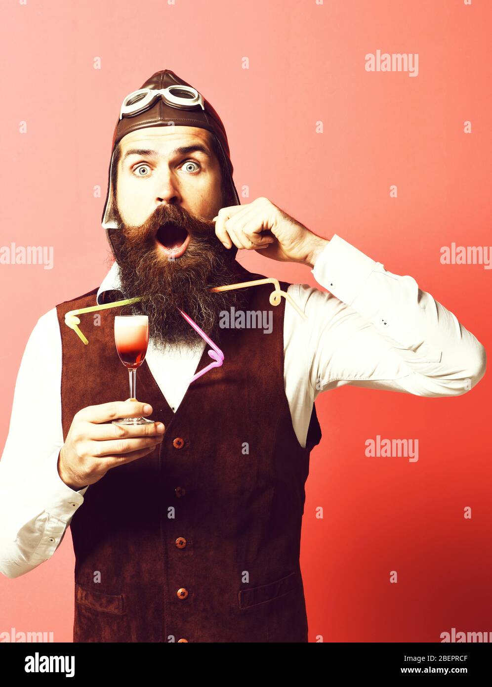 handsome bearded pilot or aviator man with long beard and mustache on ...