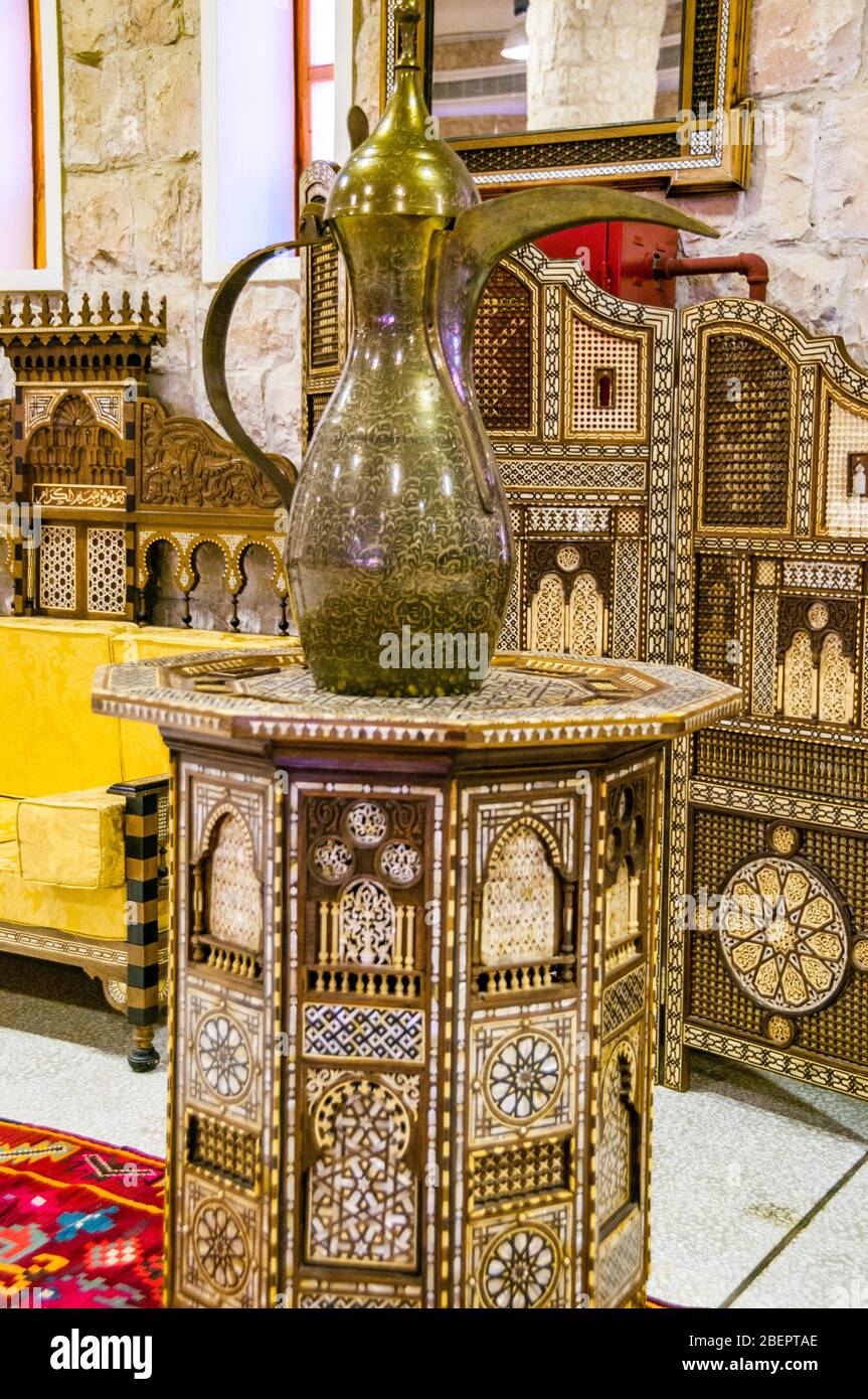 A vessel placed on a traditional Islamic ornamental stand on display at ...