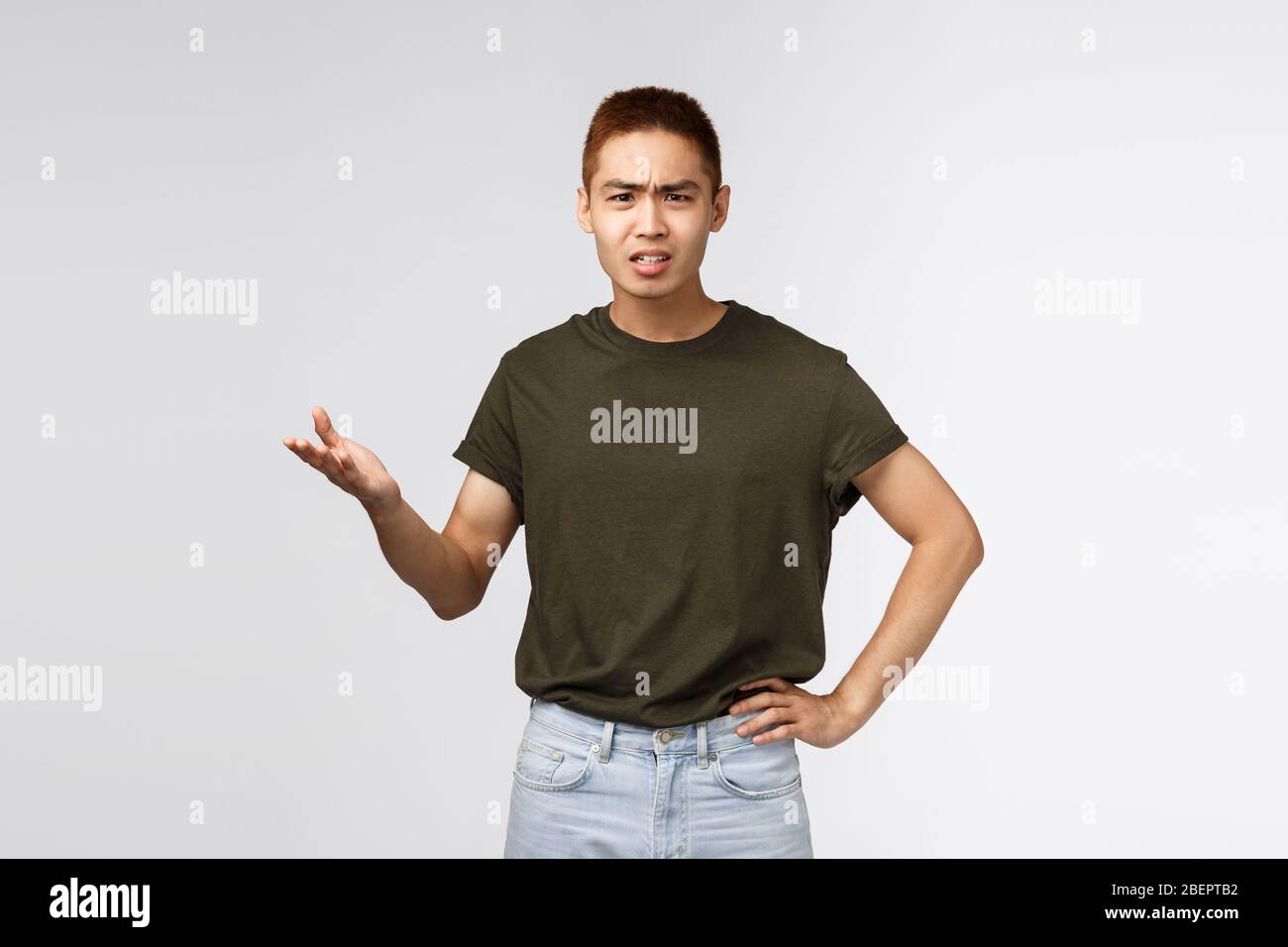 So what, why. Portrait of displeased angry asian man look frustrated ...