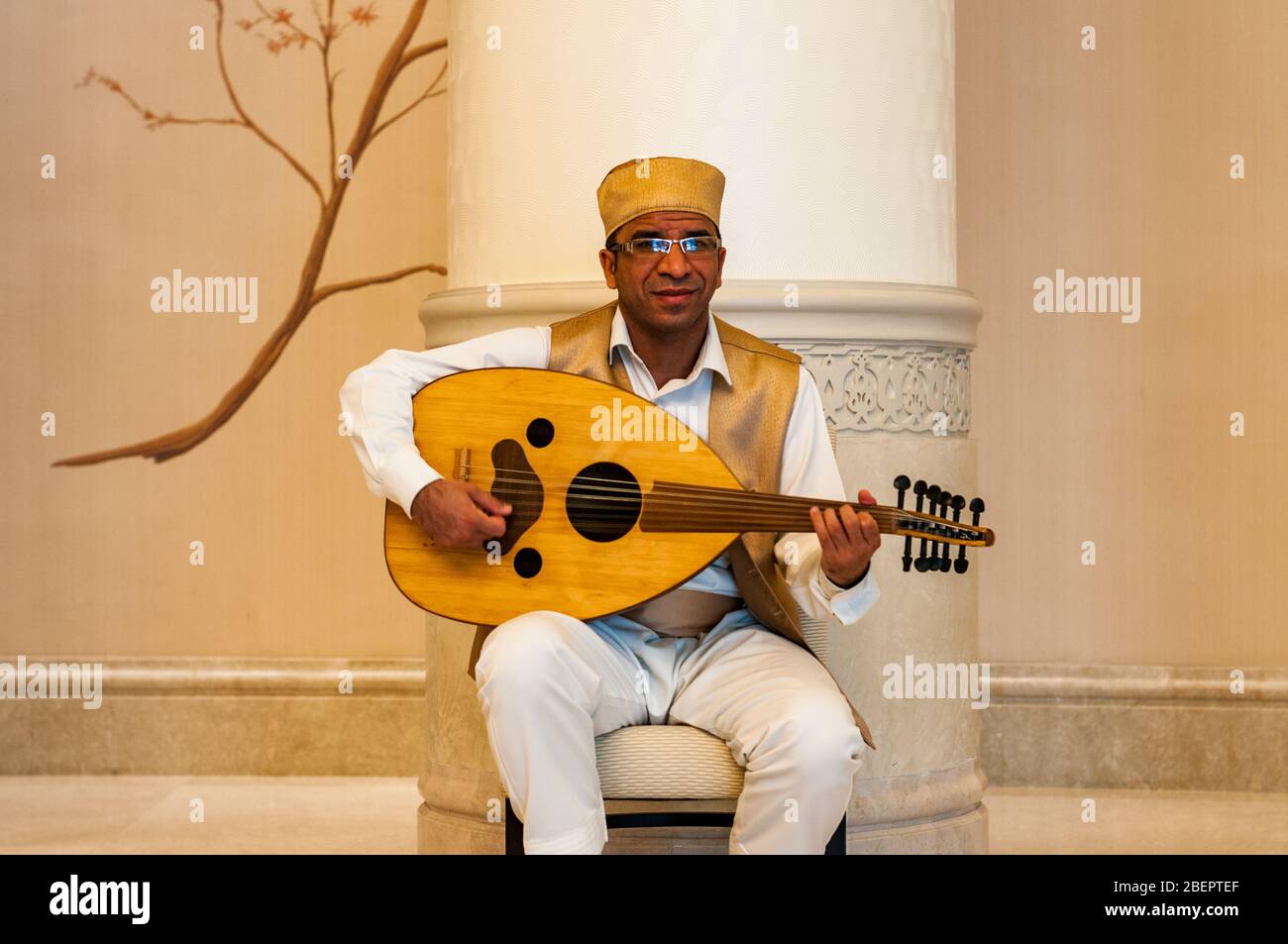 A musician plays an oud - a traditional stringed instrument - in the ...