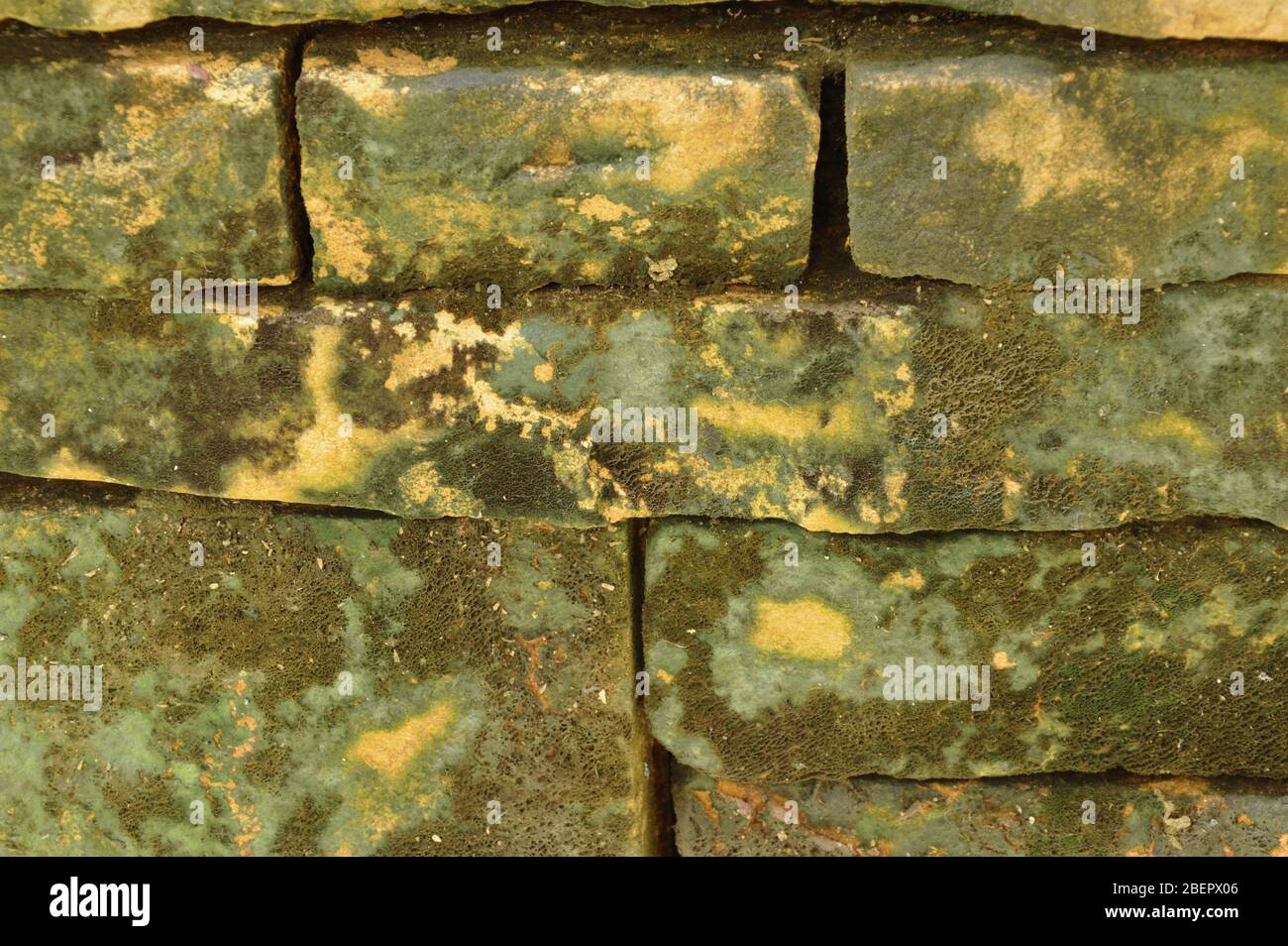 building brick wall with stain background and texture Stock Photo - Alamy