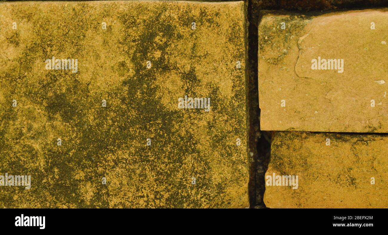 building brick wall with stain background and texture Stock Photo - Alamy