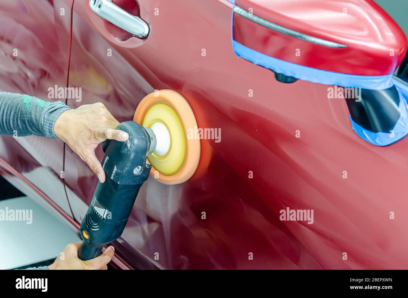 Auto polishing with machine.car polish to remove and recover the car ...