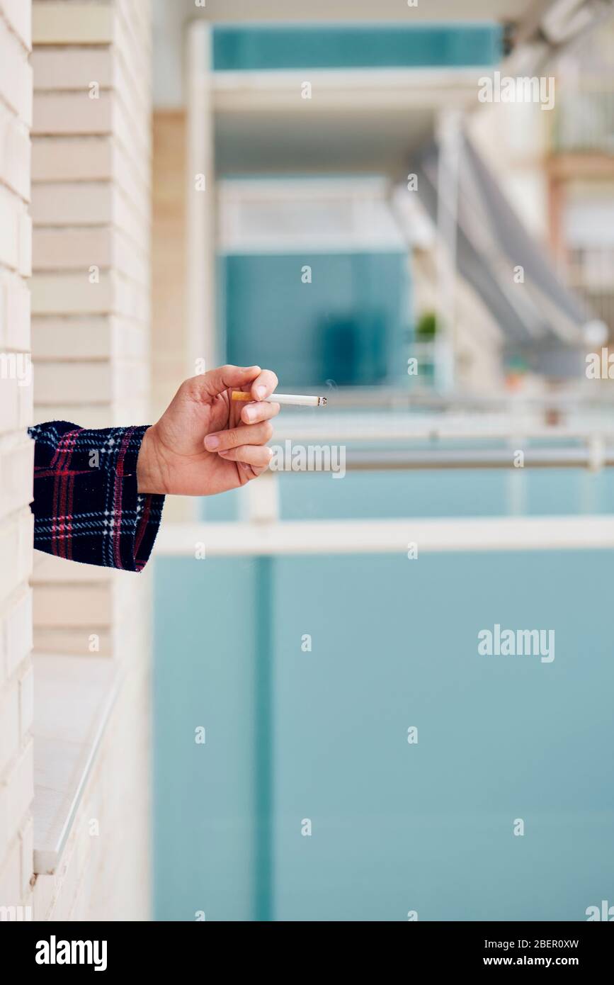 Man smoking cigarette home hi-res stock photography and images - Alamy