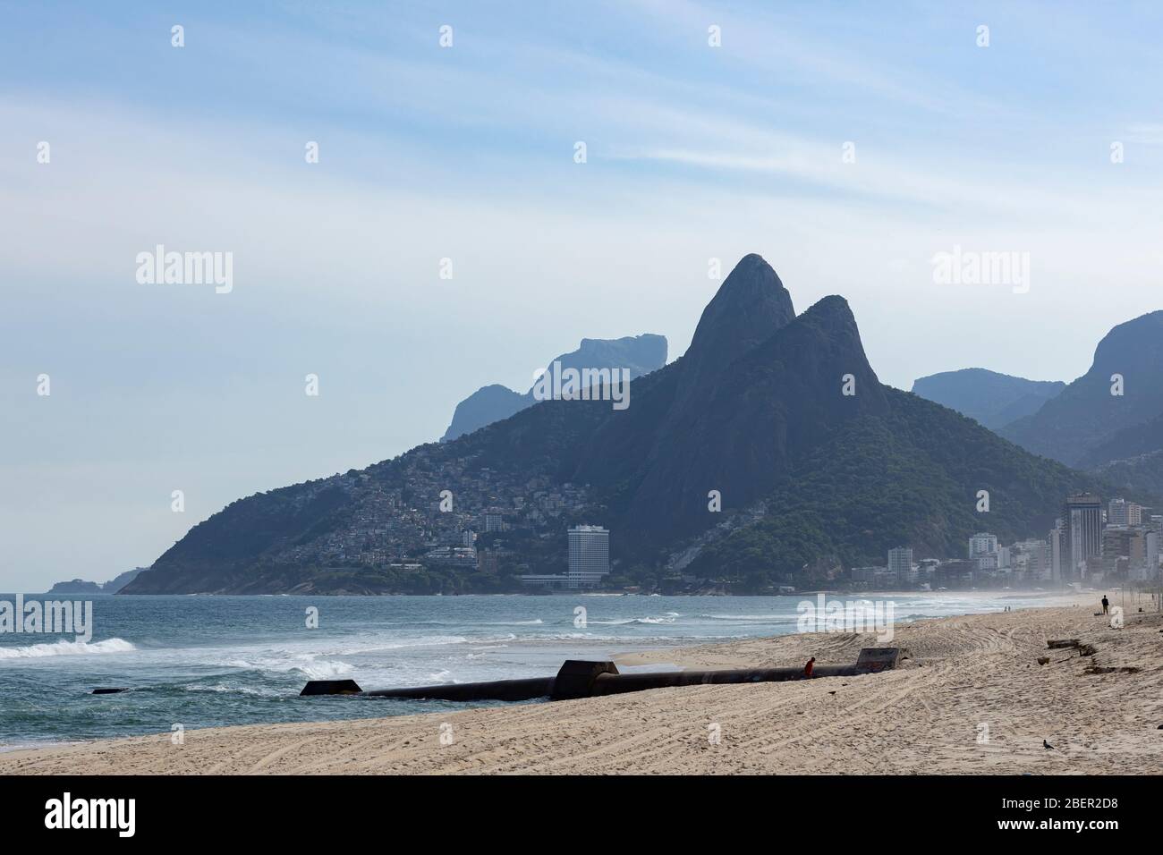 Sewer pipe exposed in empty Ipanema beach with the Two Brothers ...