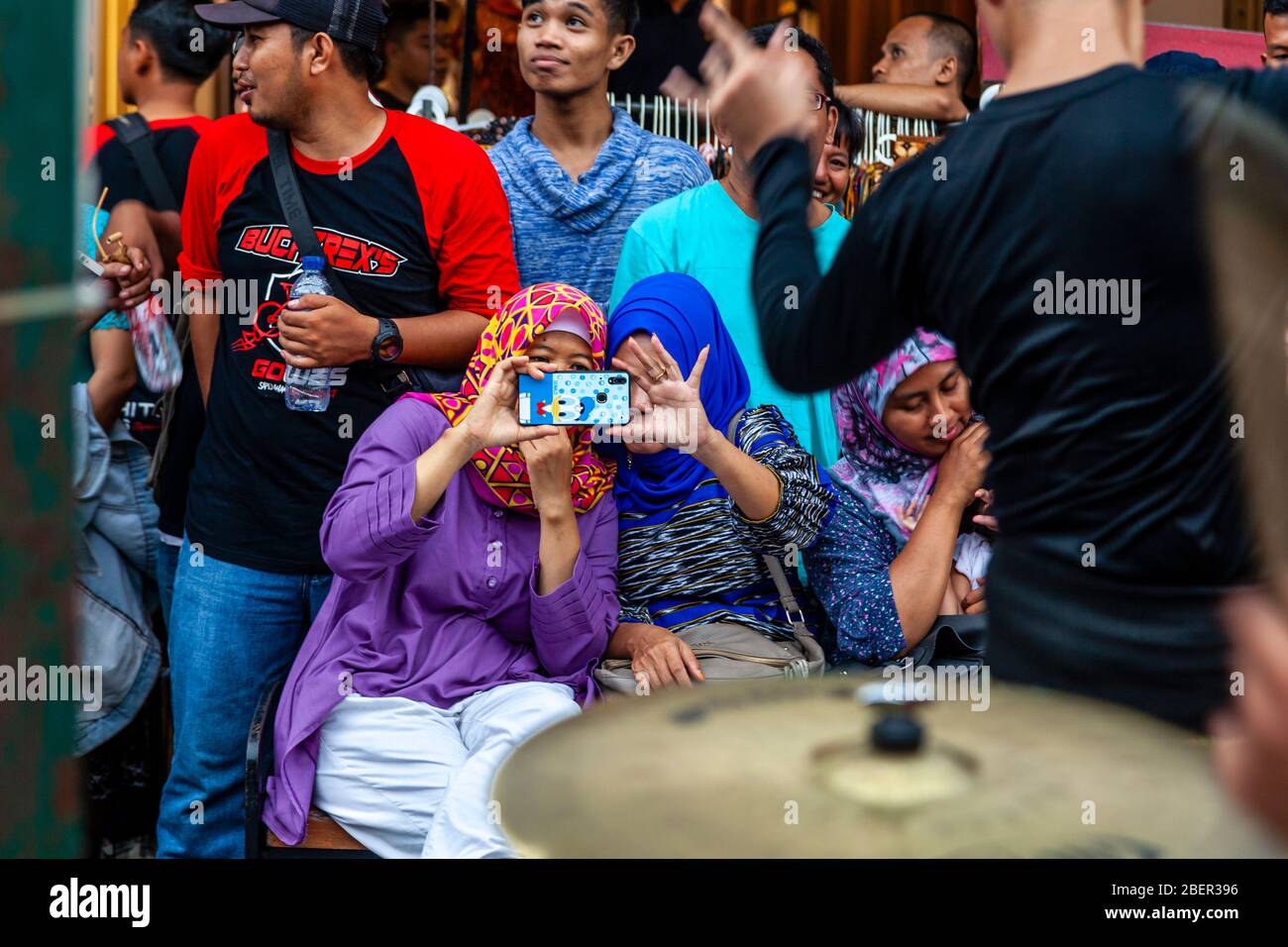 Indonesian People Taking Photos Of Street Entertainers In Malioboro ...