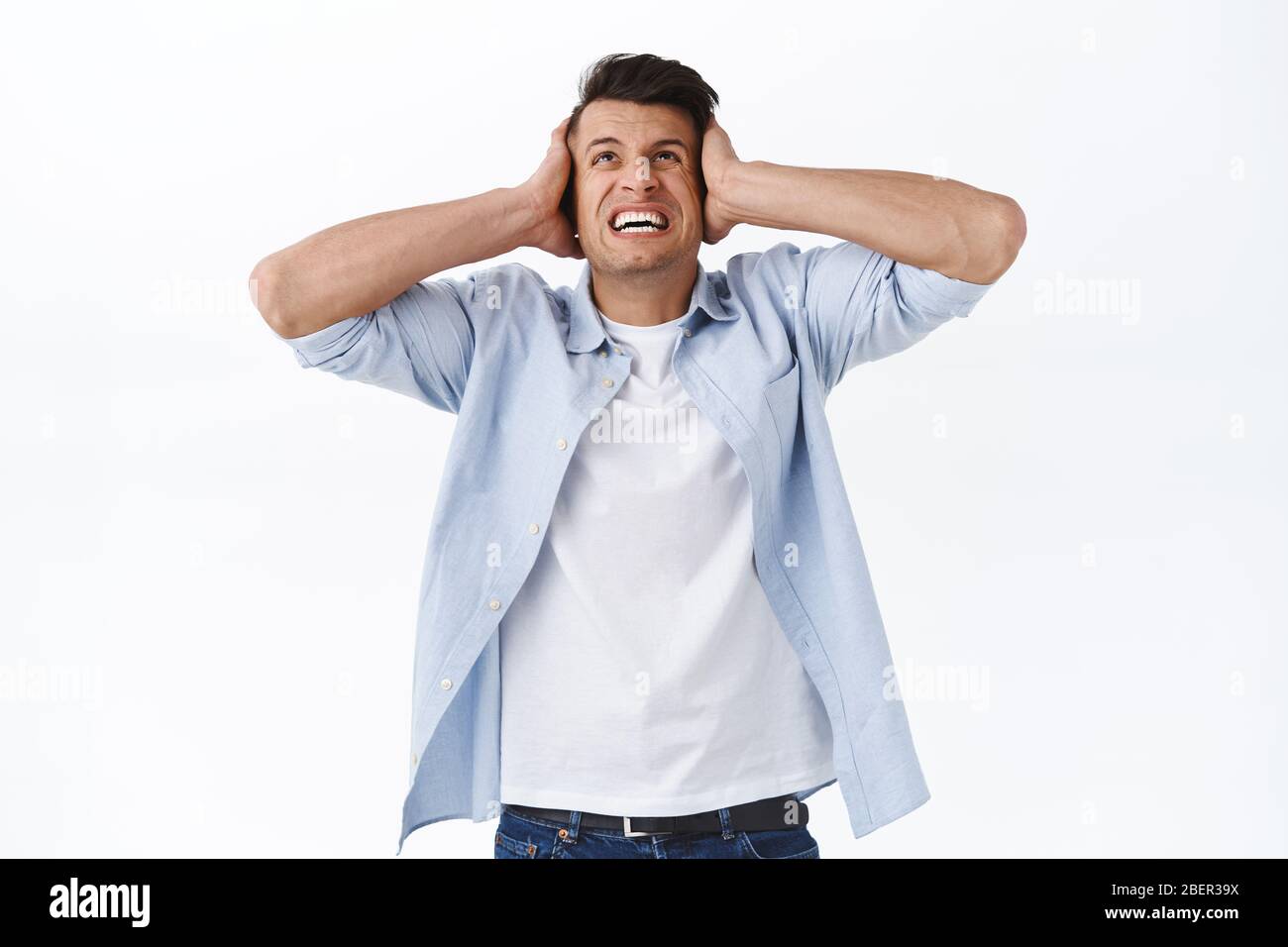 Man cant stand his noisy loud neighbours upstairs. Portrait of annoyed ...