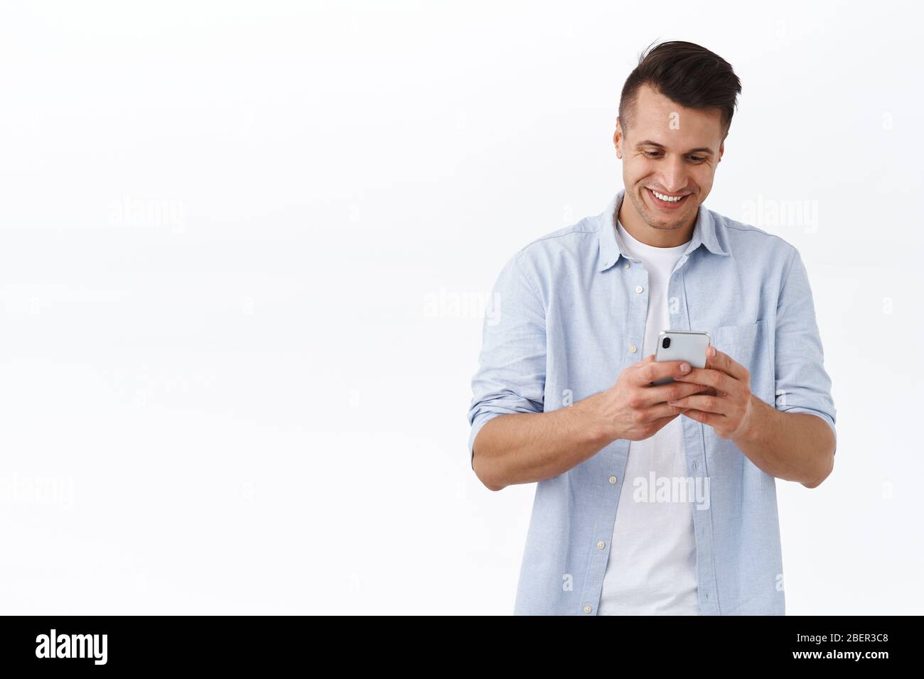 Communcation, messaging and online lifestyle concept. Cheerful handsome ...