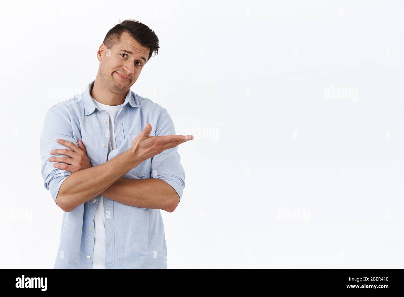 Portrait of skeptical handsome young man smirk uncertain, introduce ...