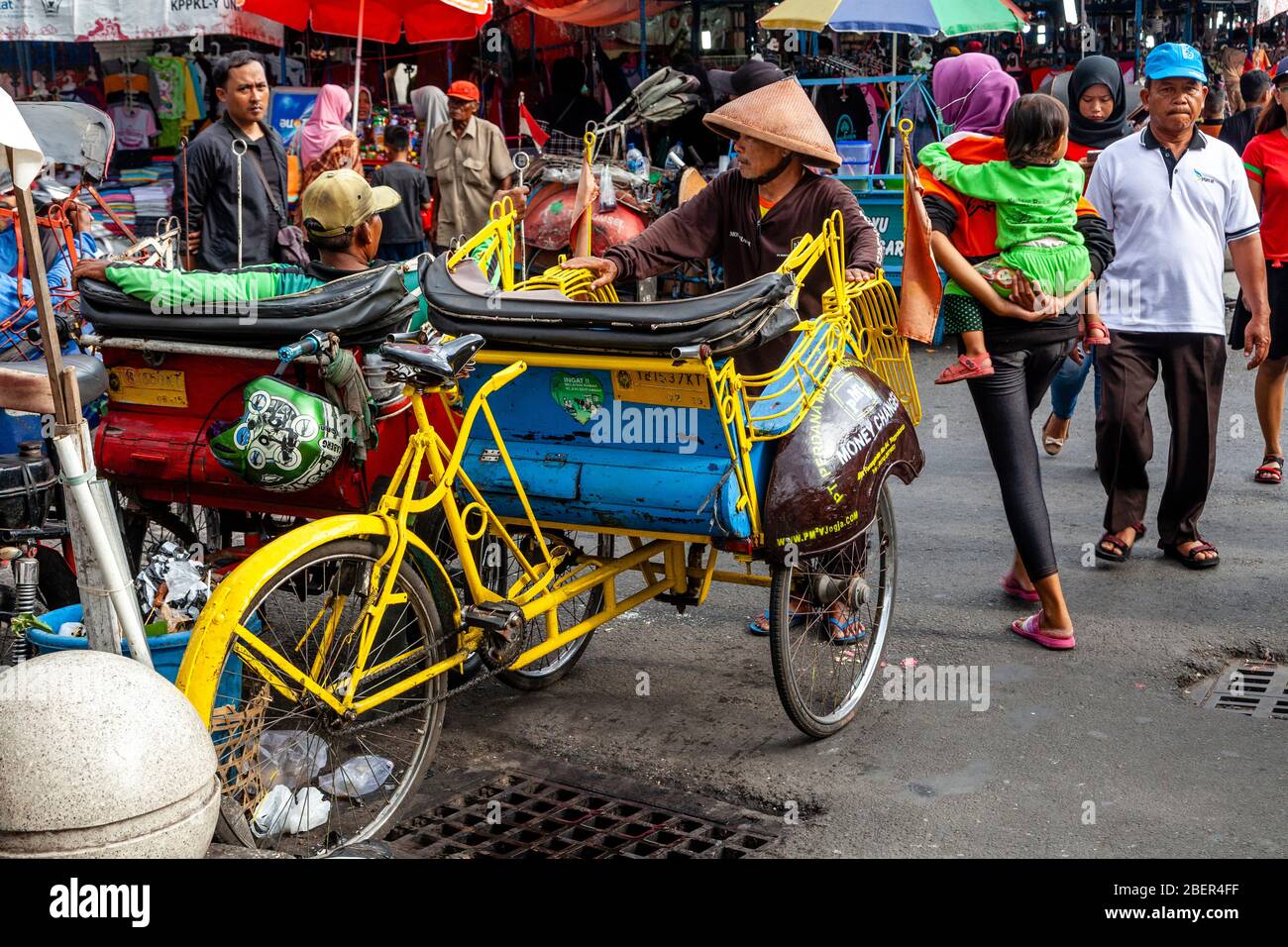 A Traditional Becak (Cycle Rickshaw) and Driver, Malioboro Street ...