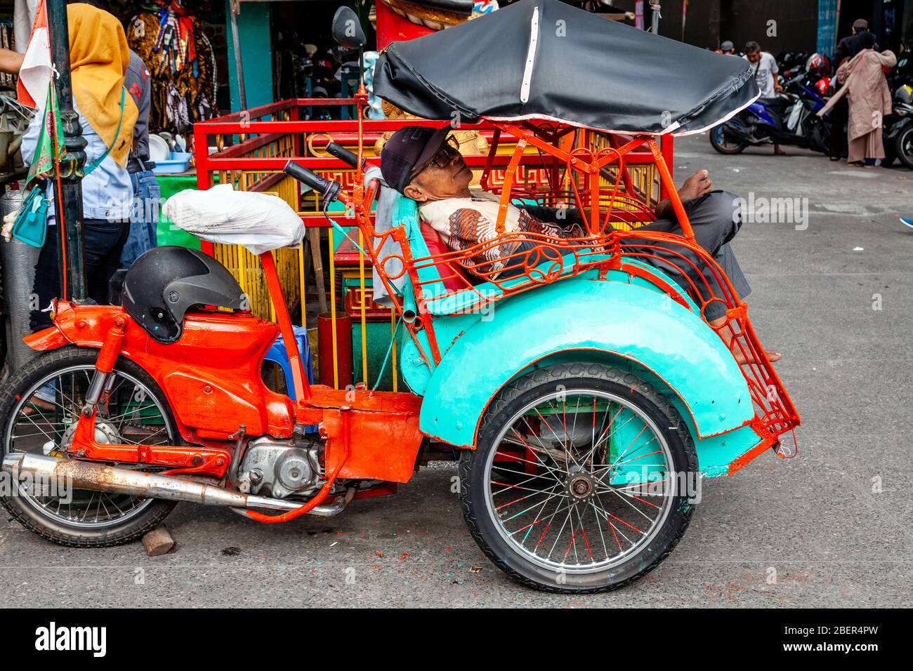 A Motorcycle Taxi Driver Resting, Malioboro Street, Yogyakarta, Java ...