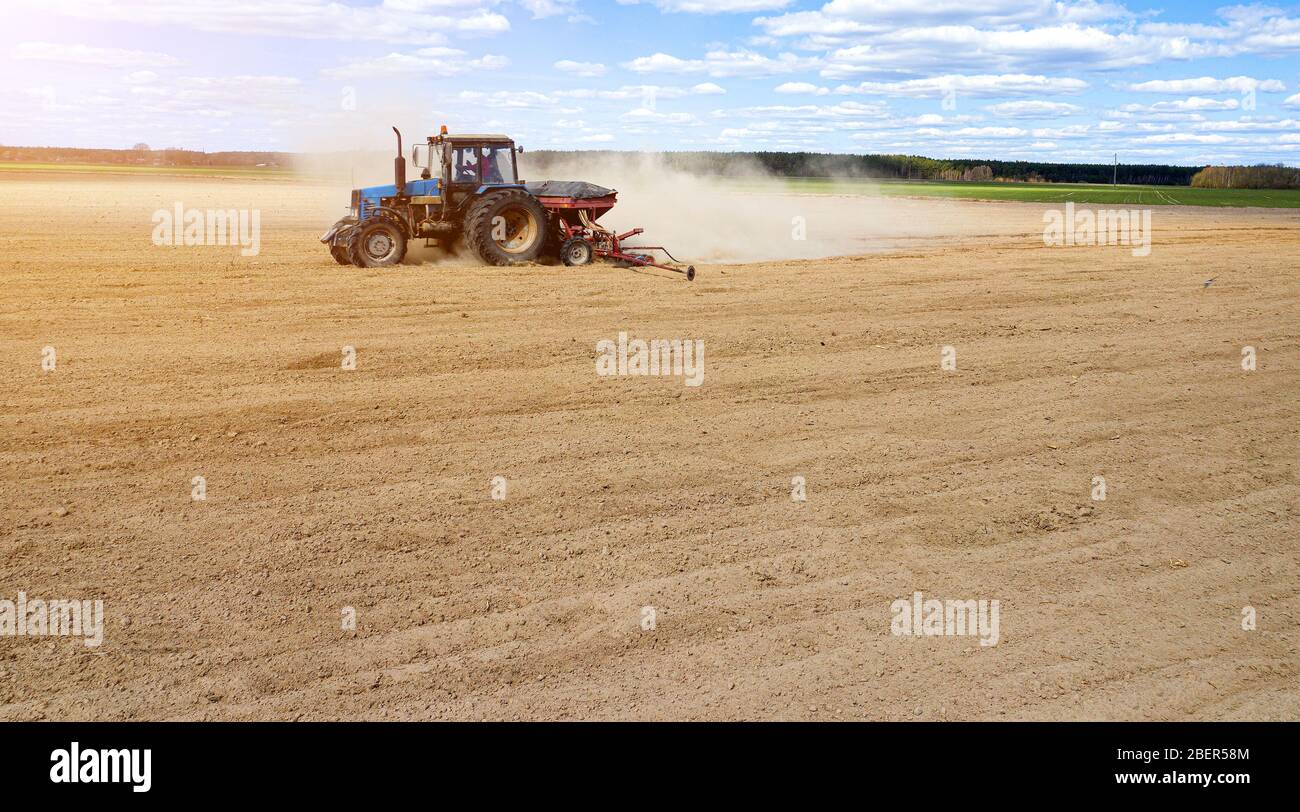 Farmer seeding, sowing crops at field. Sowing is the process of ...