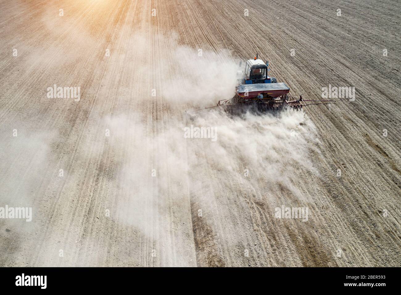 Farmer seeding, sowing crops at field. Sowing is the process of ...