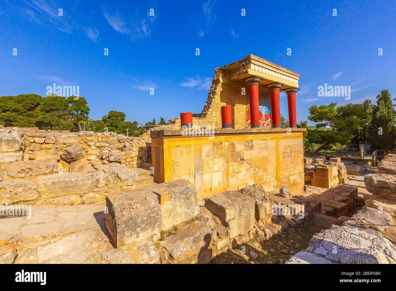 Side view of red columns, North Entrance of ancient Minoan Palace in ...