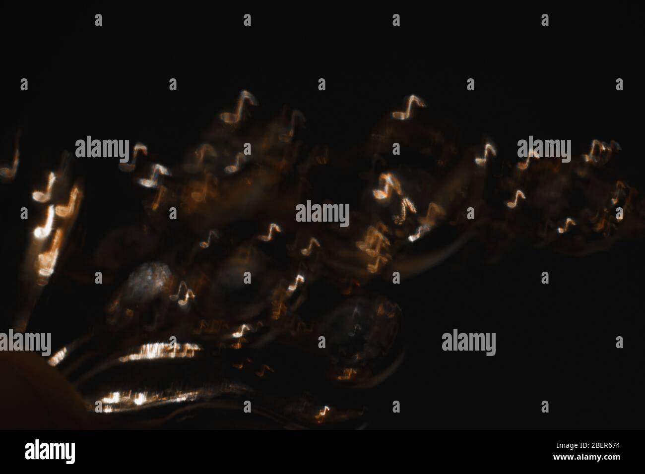 Gold notes on black background Stock Photo - Alamy