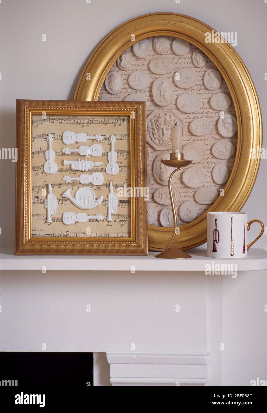 Gilt frames on mantlepiece Stock Photo - Alamy