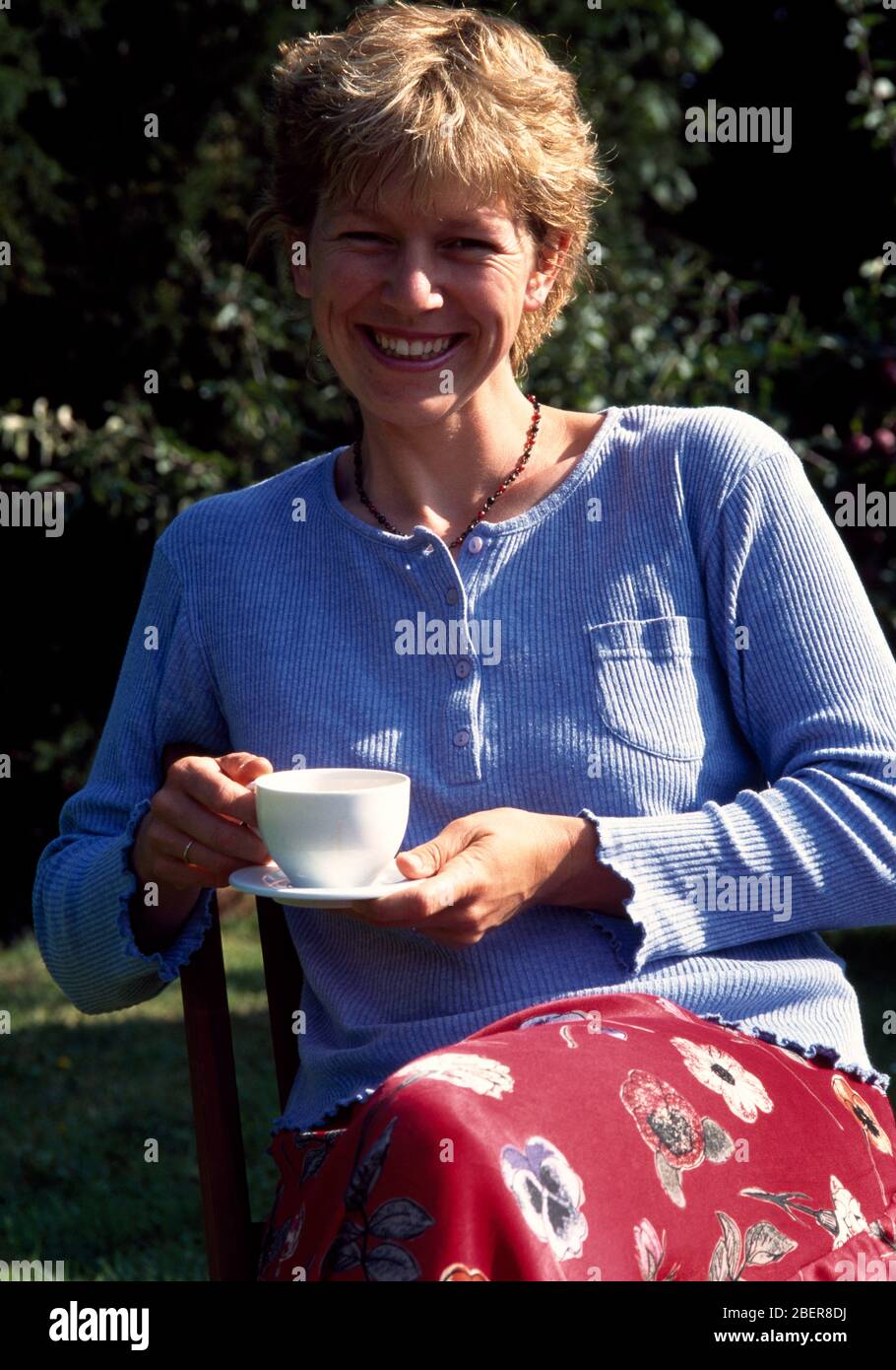 woman relaxing with cup of tea Stock Photo - Alamy