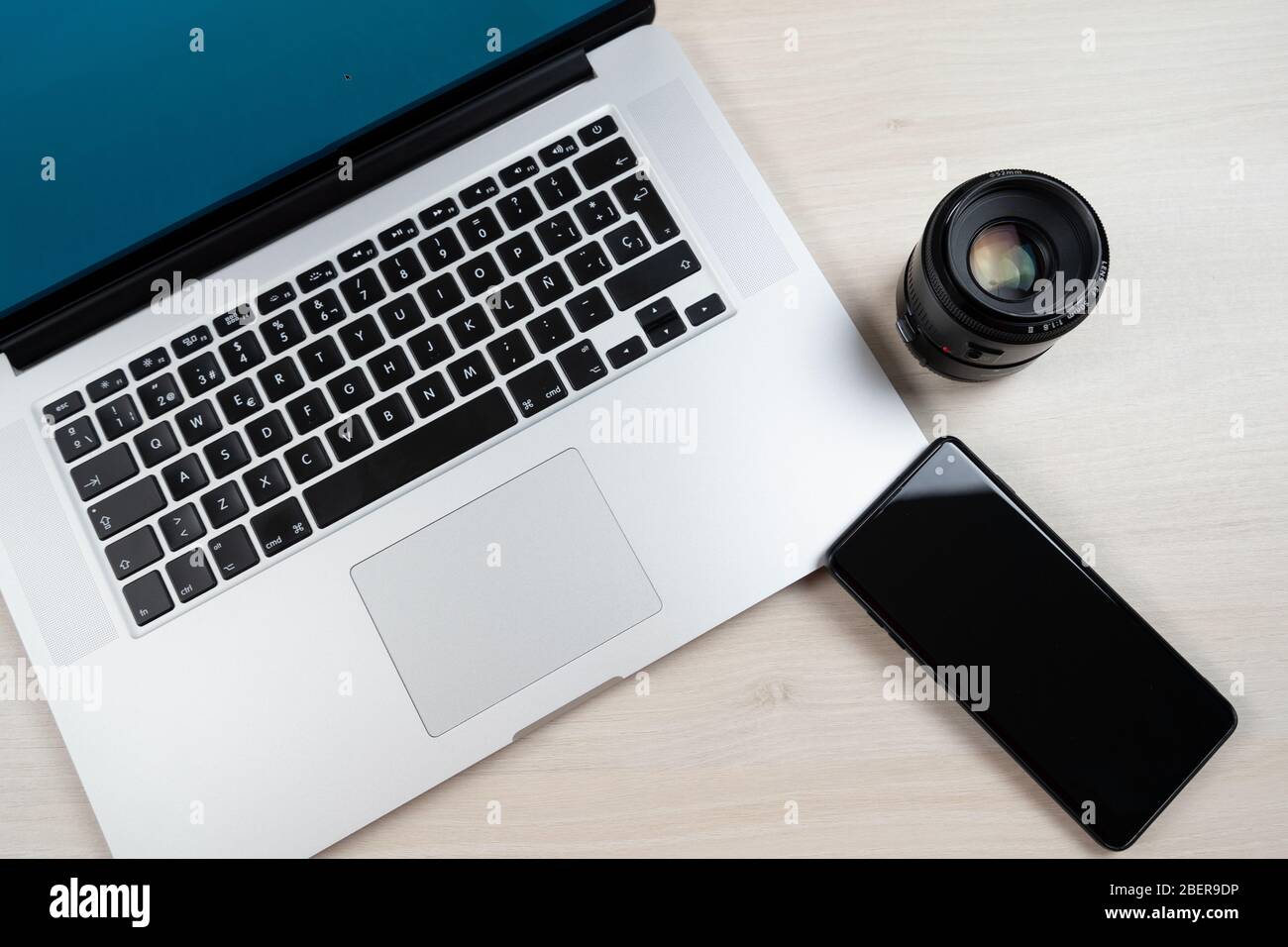 Laptop, lens and headphones with camera Stock Photo - Alamy
