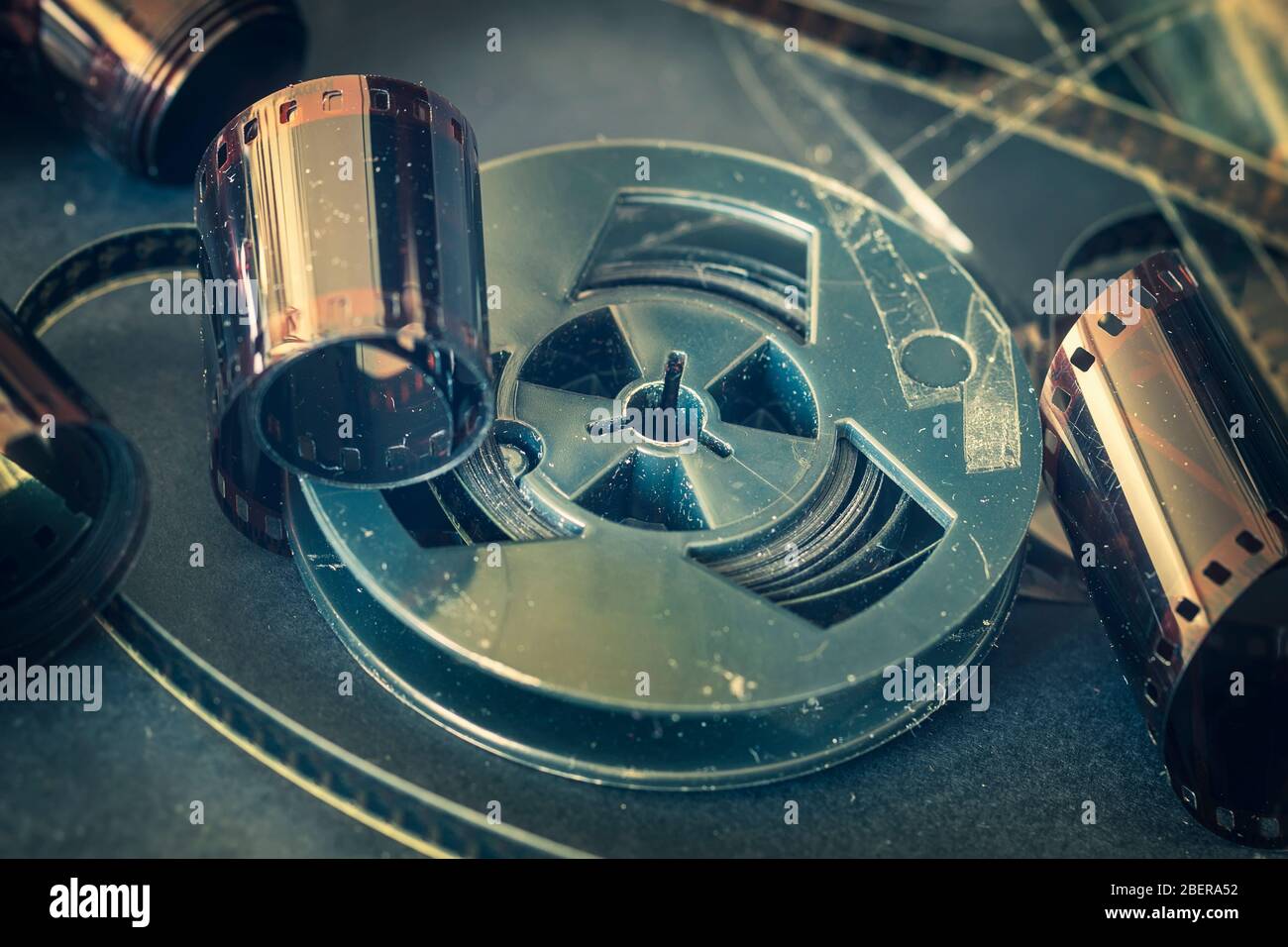 Old dirty movie coil and photographic films. Vintage background, retro ...