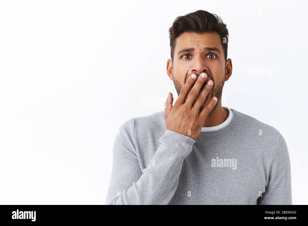 Bored guy trying look interested, open mouth wide and cover it with ...