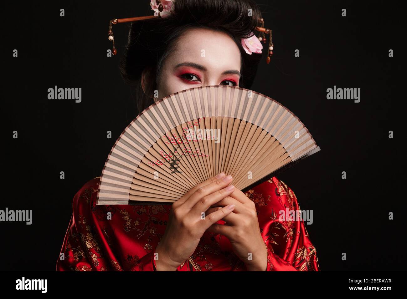 Image of young geisha woman in traditional japanese kimono holding ...