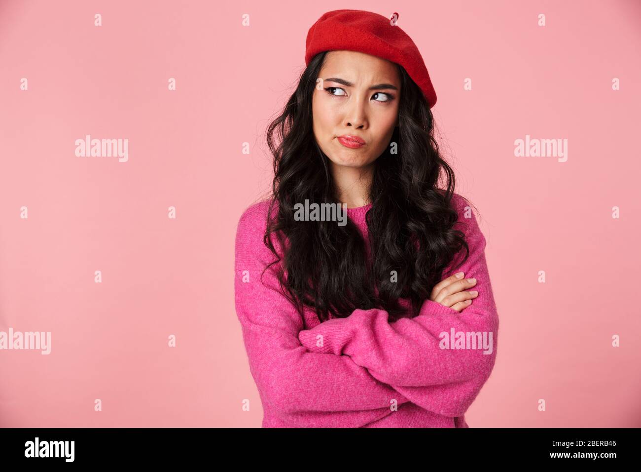 Image of discontent beautiful asian girl with long dark hair wearing ...