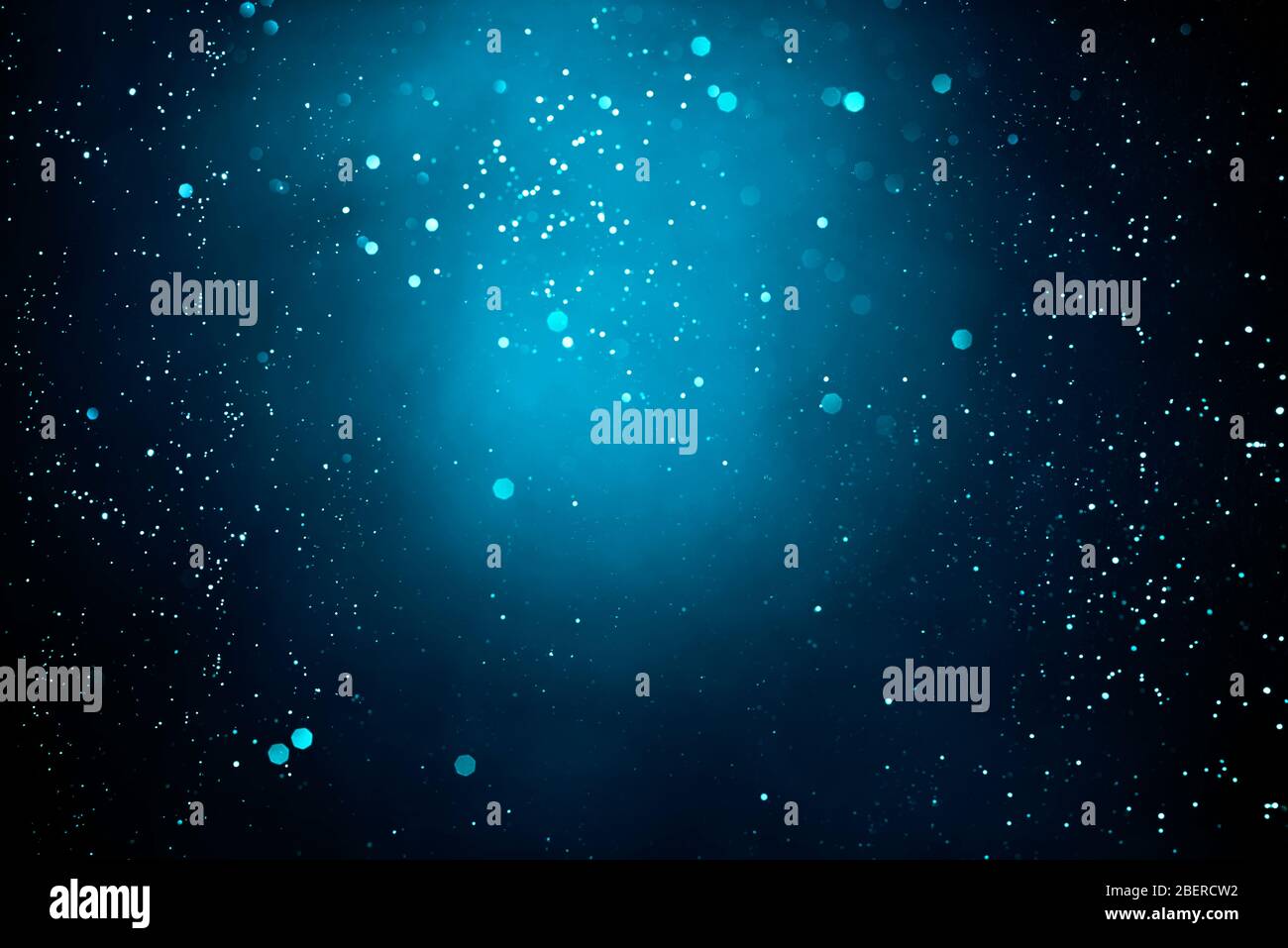 Abstract background with glowing turquoise particles Stock Photo - Alamy
