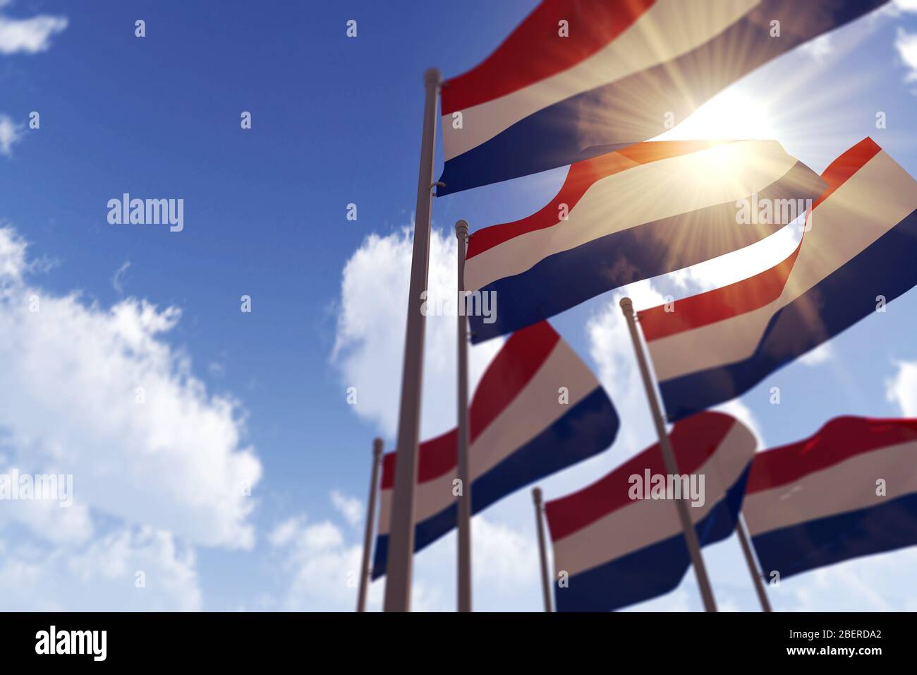 Netherlands flags waving in the wind against a blue sky. 3D Rendering ...