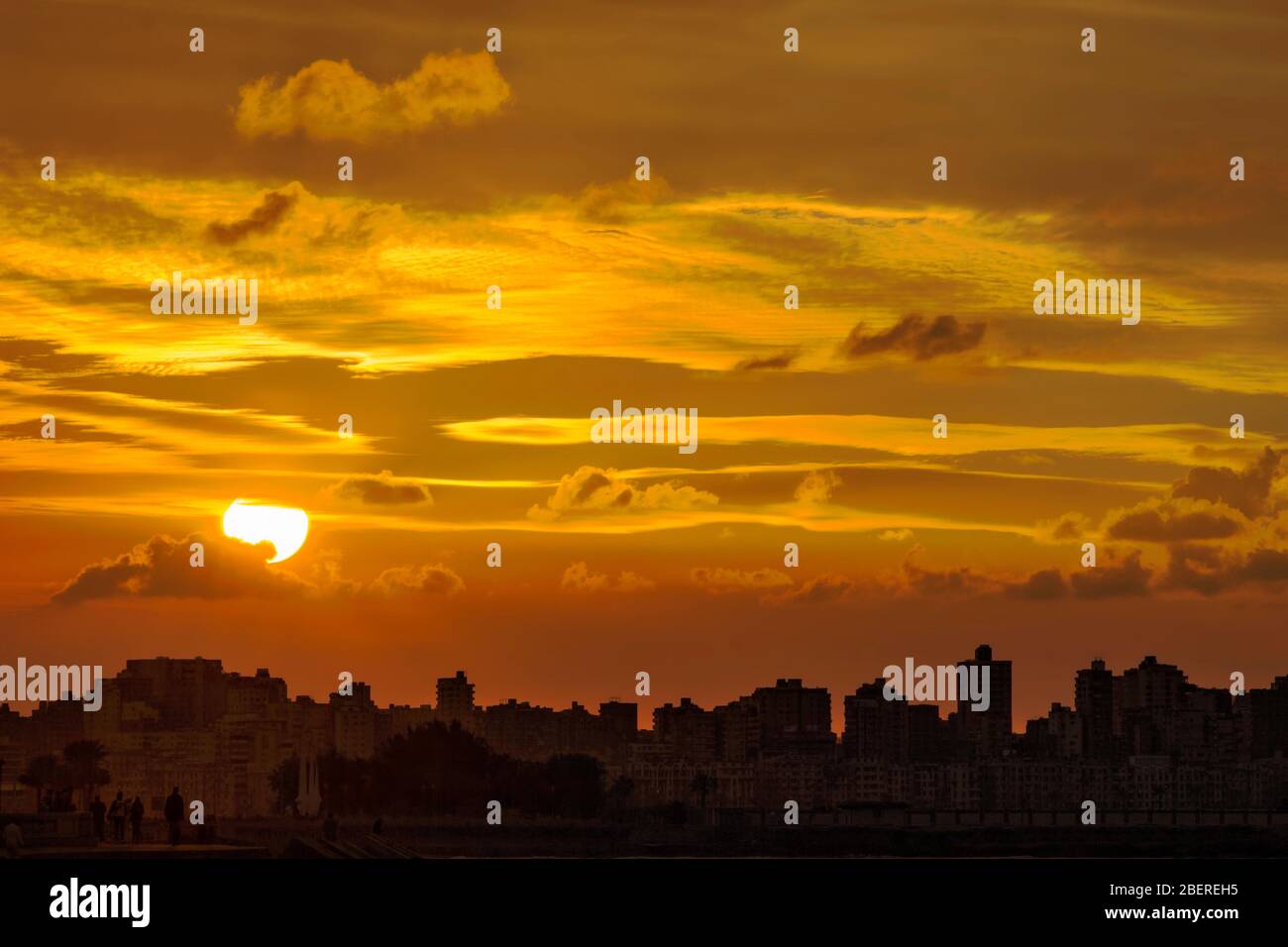 Beautiful sunset over silhouette of arabic town. Silhouette of city ...