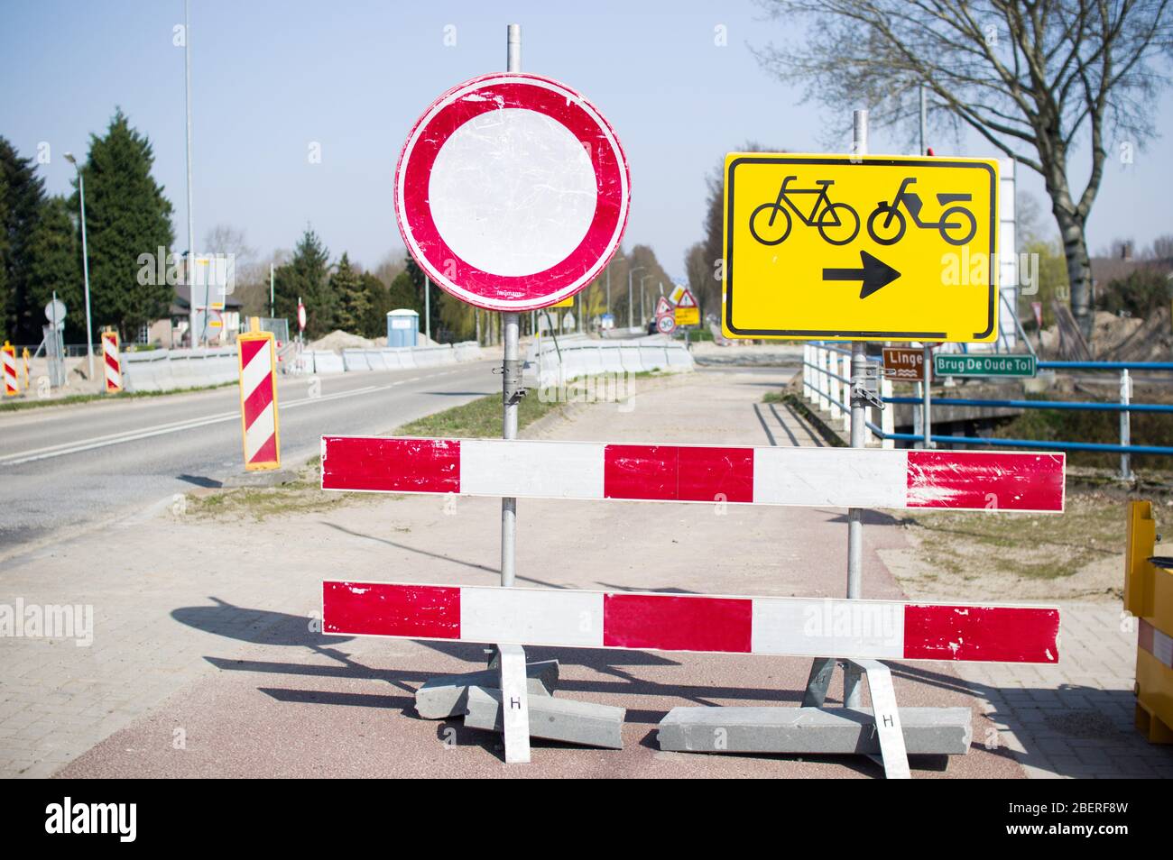 Road closed with barriers and sign for cyclists for roadworks Stock ...