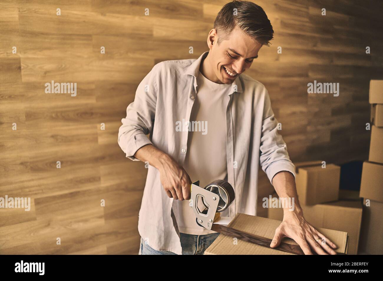 Handsome man packing box hi-res stock photography and images - Alamy