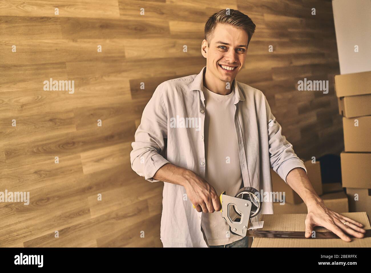 Handsome man packing box hi-res stock photography and images - Alamy