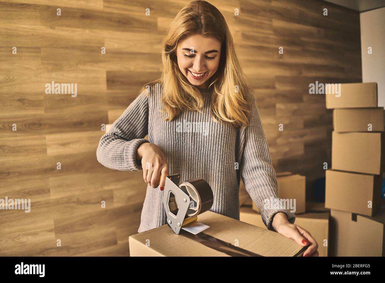 Attractive smiling woman getting ready to move into new house Stock ...