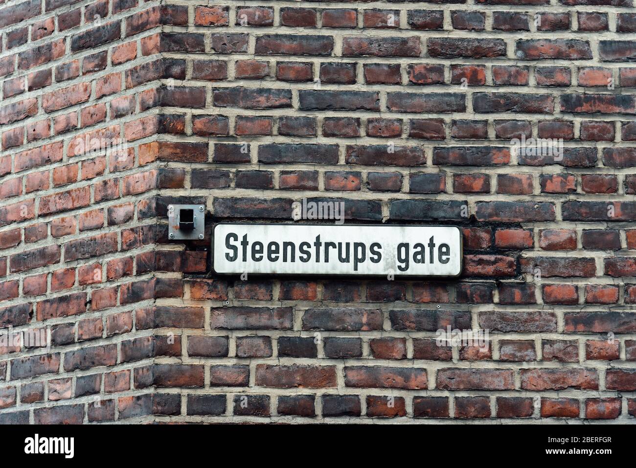 Street name sign on old brick wall in Oslo. Steenstrups gate Stock ...