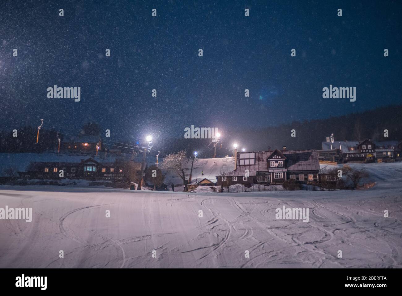 VELKA UPA, CZECH REPUBLIC, MARCH 2020 - Ski village at night with slope ...