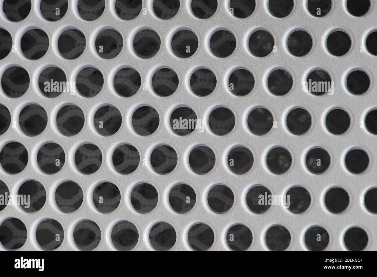 Pattern of vent holes. White plastic mesh barrier Stock Photo - Alamy